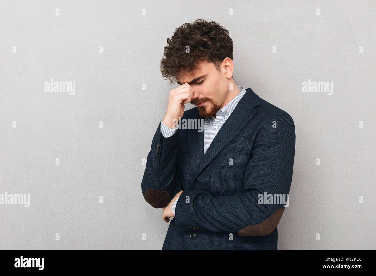 Face stressed young businessman thinking hi-res stock photography and ...