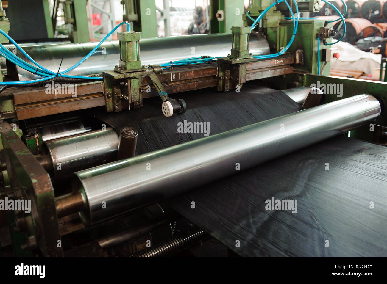 The process of rolling rubber Stock Photo - Alamy