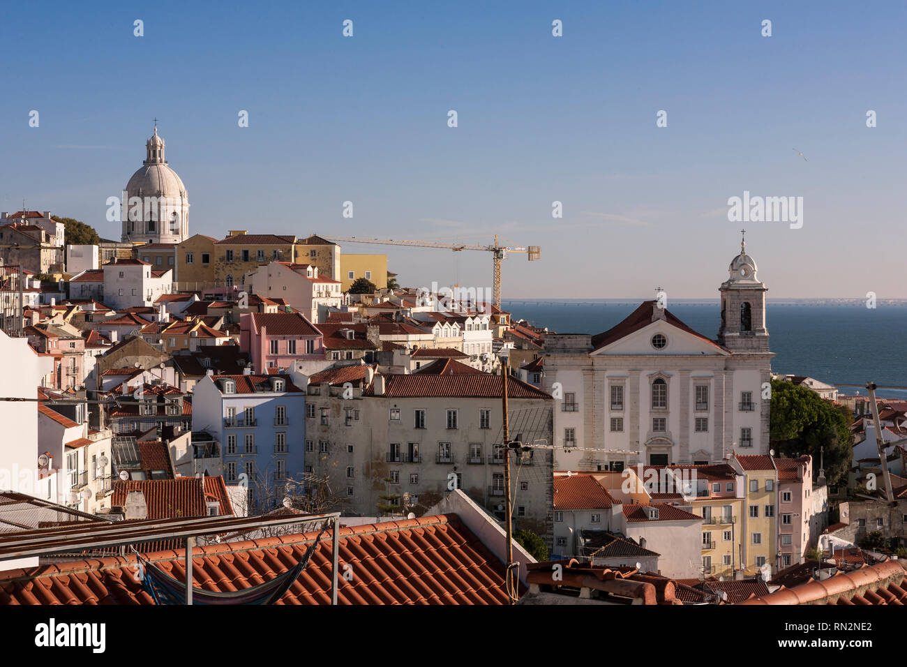 View over Alfama and the Rio Tejo from the Miradouro de Santa Luzia ...
