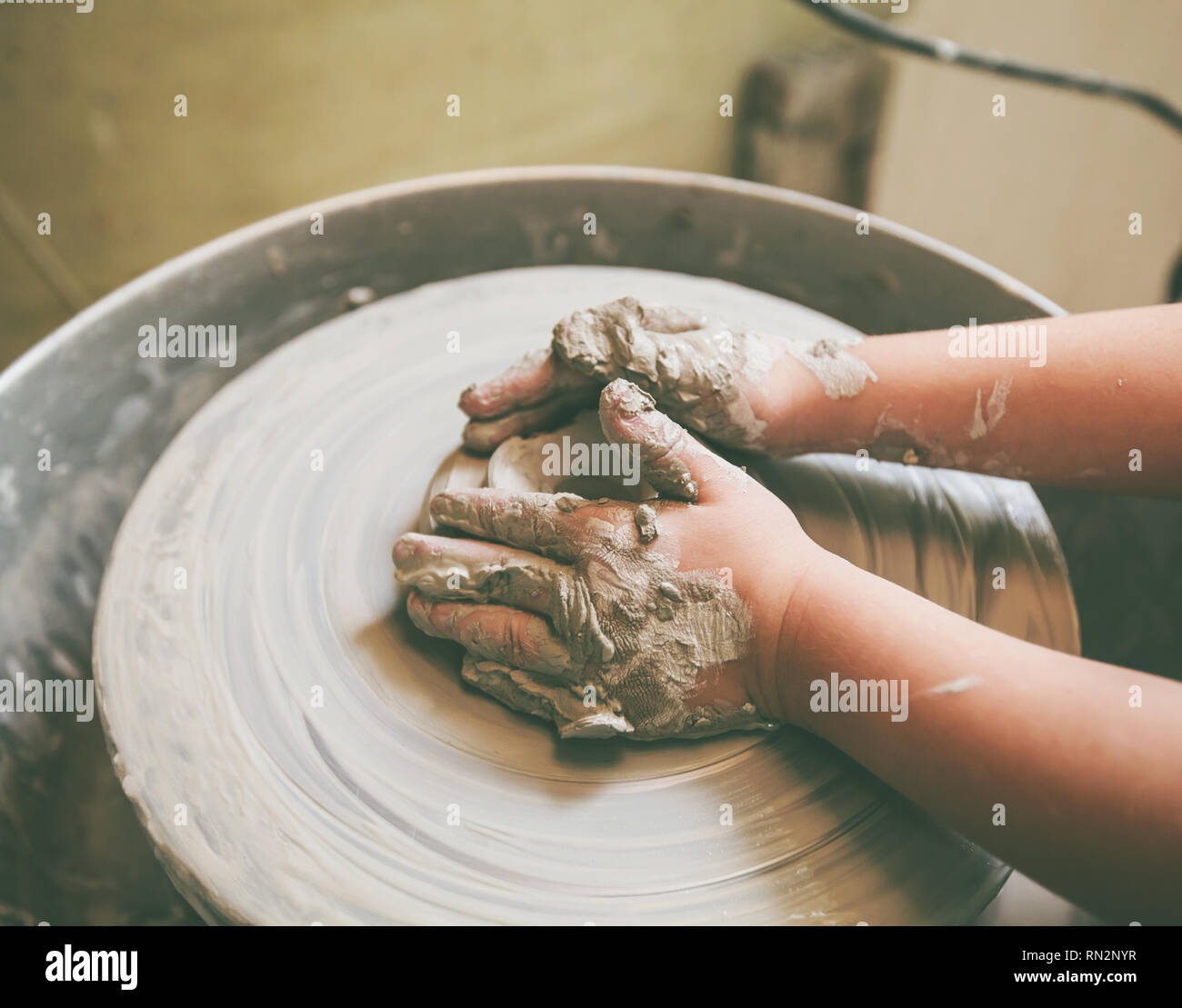 Young artist hands shaping clay on pottery wheel at workshop Stock ...