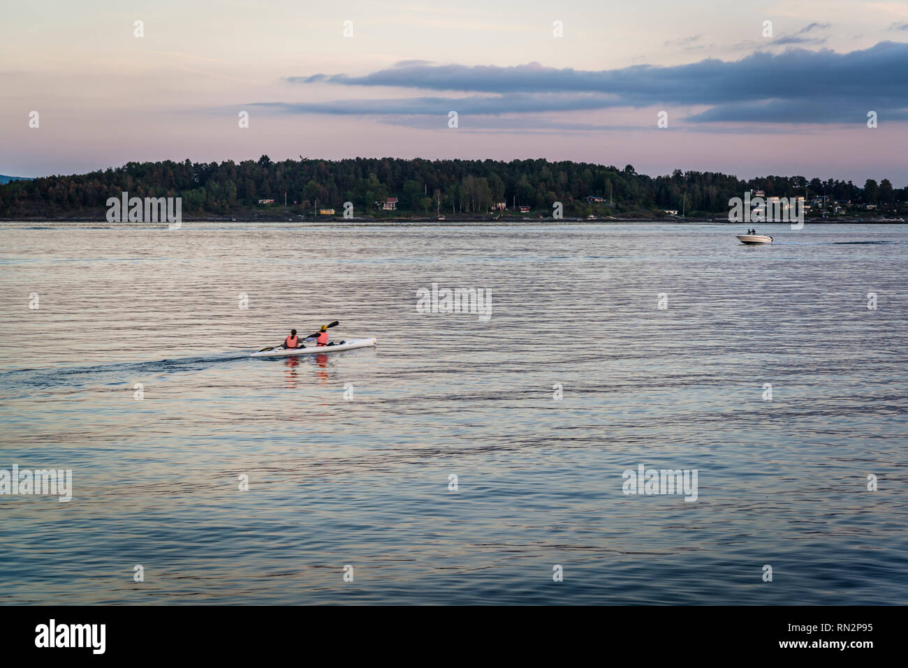 Two people rowing in Oslofjord at Bygdoy peninsula, Oslo, Norway Stock ...