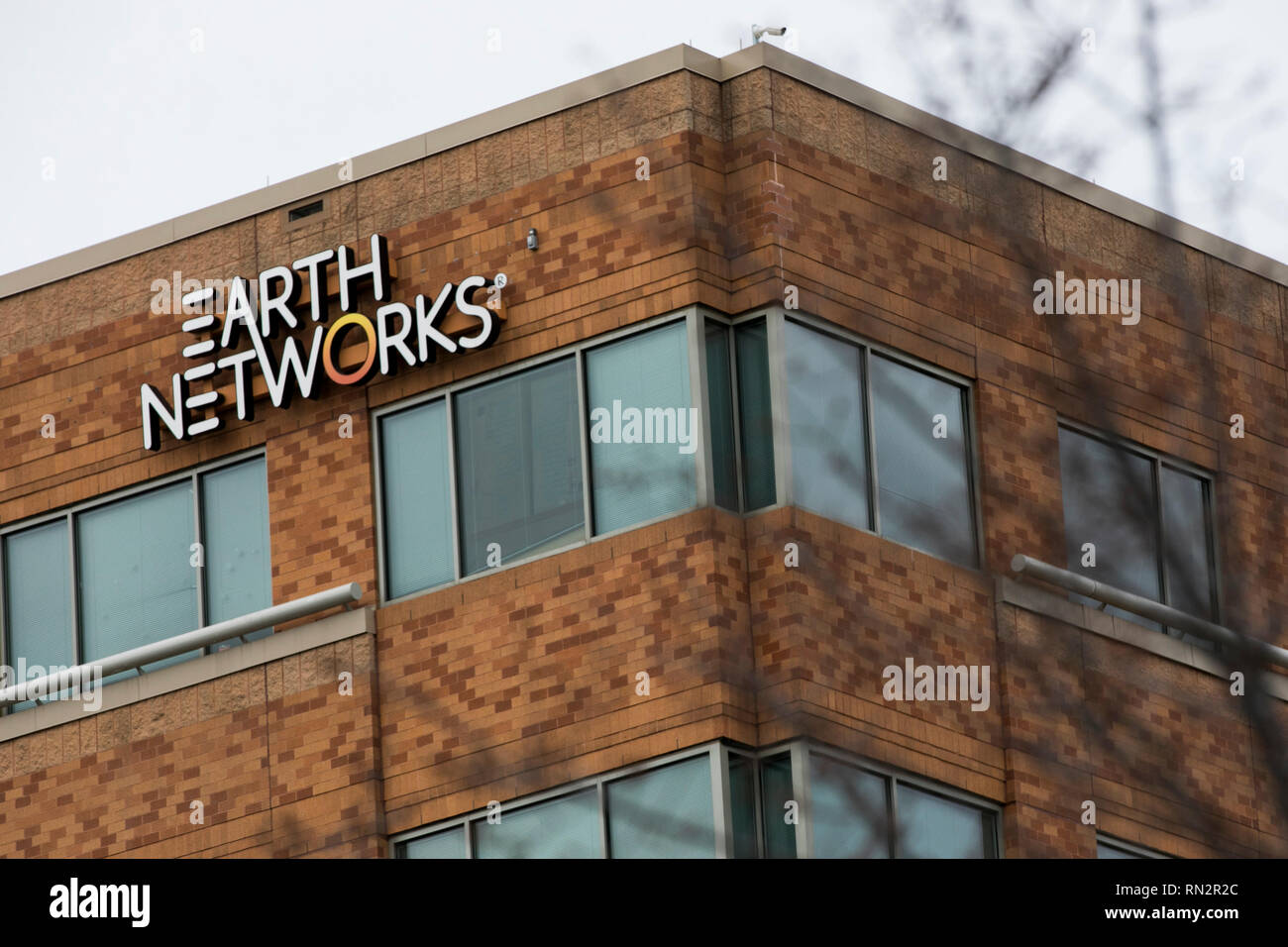 A logo sign outside of the headquarters of Earth Networks in Germantown ...