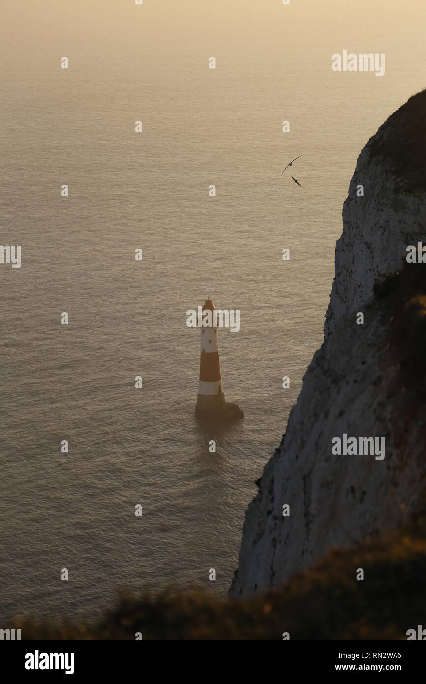 Beachy Head Lighthouse in sunset with cliff Stock Photo - Alamy