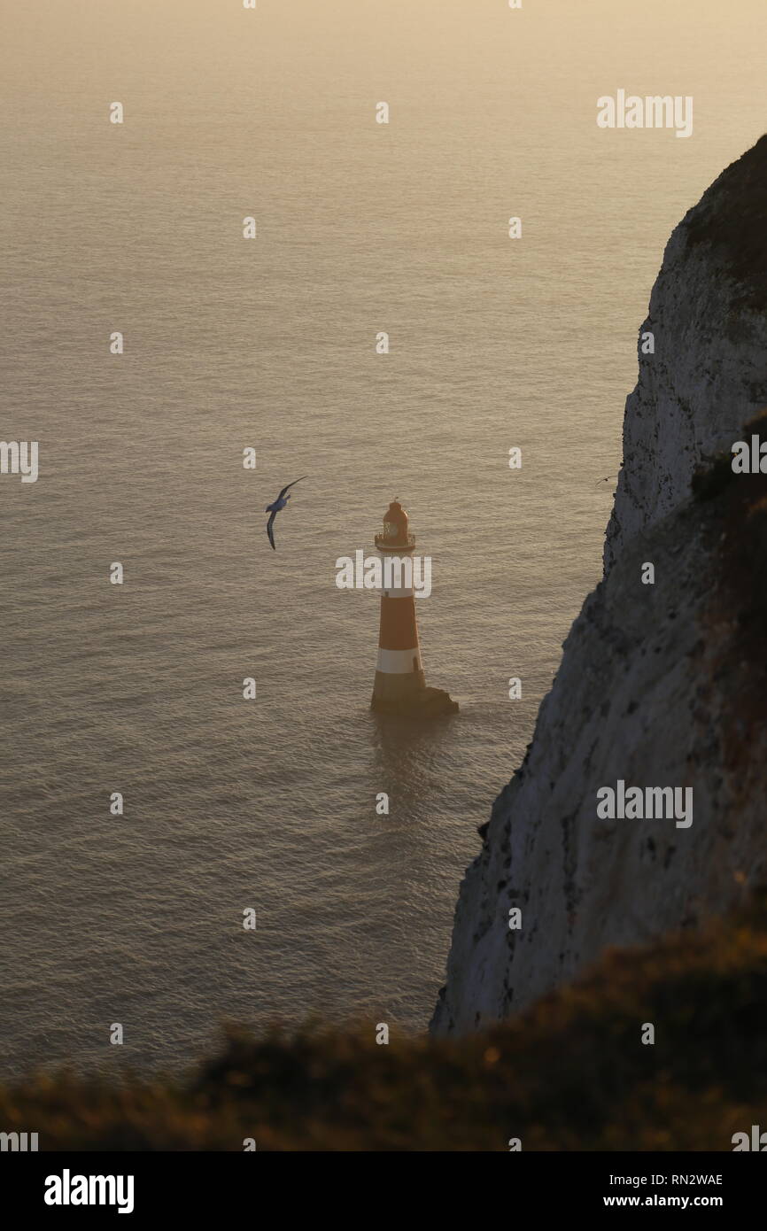 Beachy Head Lighthouse in sunset with cliff Stock Photo - Alamy