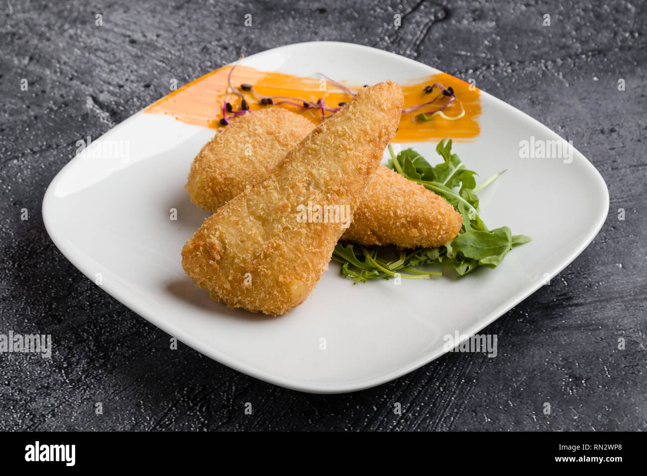 tasty fresh fried breaded cheese on white palte Stock Photo - Alamy