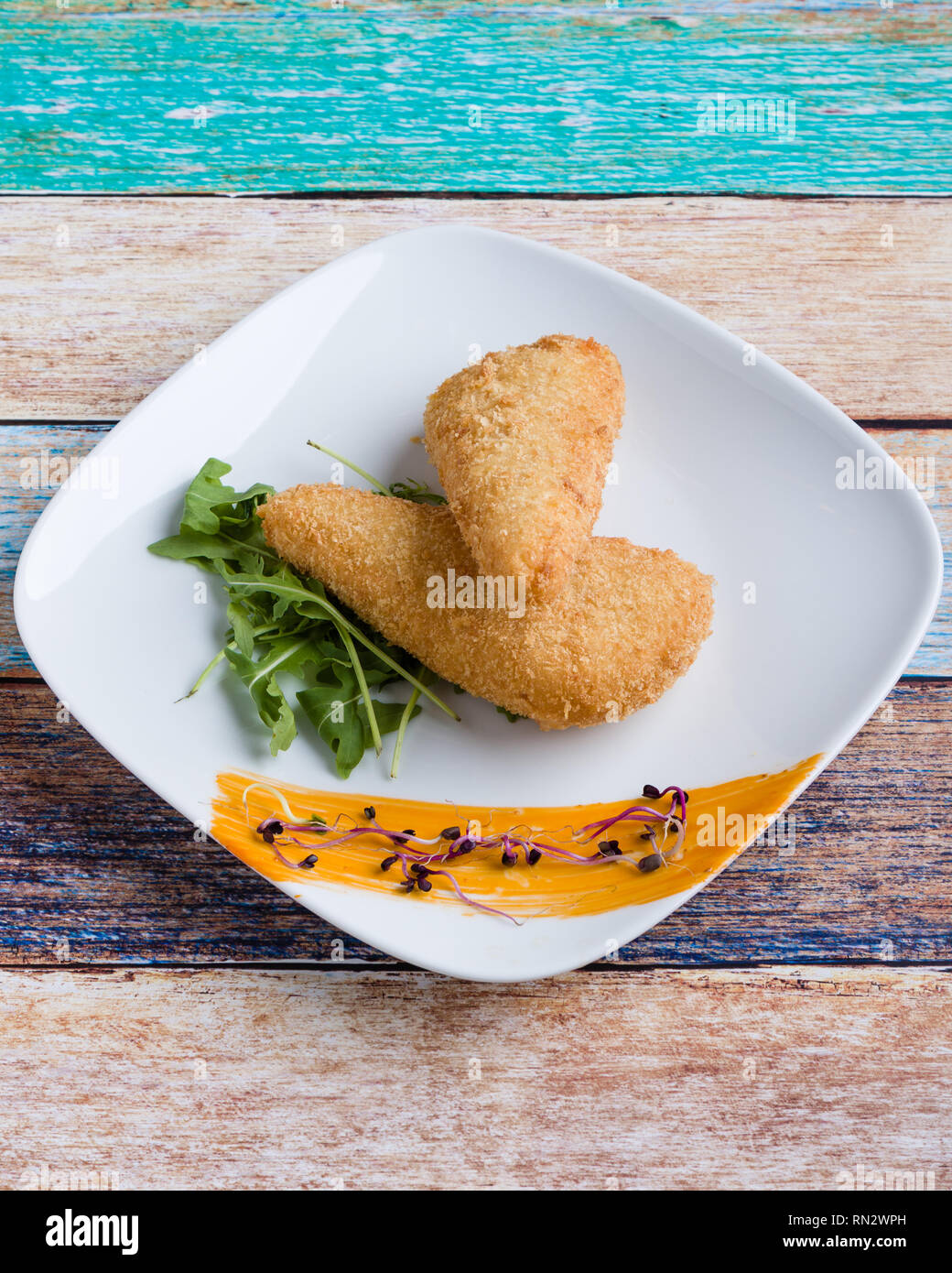 tasty fresh fried breaded cheese on white palte Stock Photo - Alamy