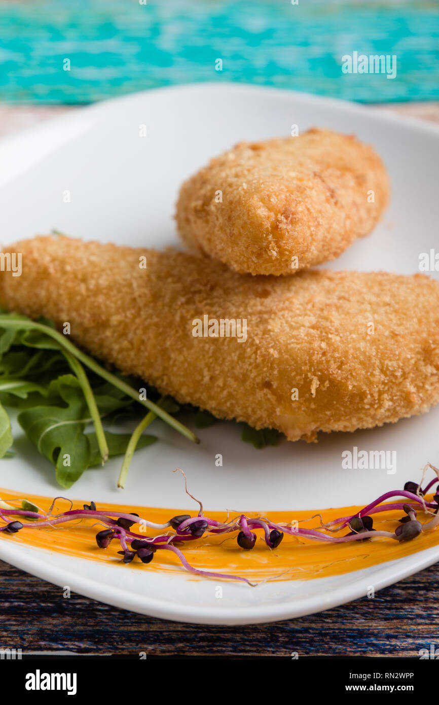 tasty fresh fried breaded cheese on white palte Stock Photo - Alamy
