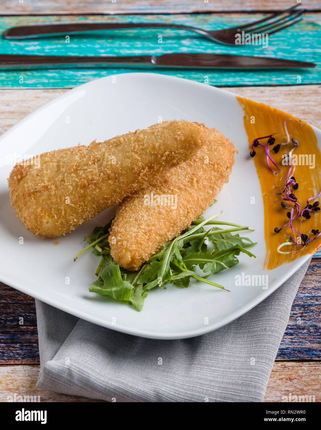 tasty fresh fried breaded cheese on white palte Stock Photo - Alamy