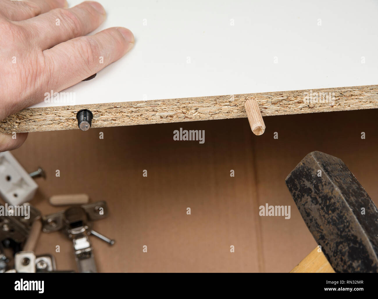 Handyman Is Assembling A Cabinet Furniture Put Together Concept Stock