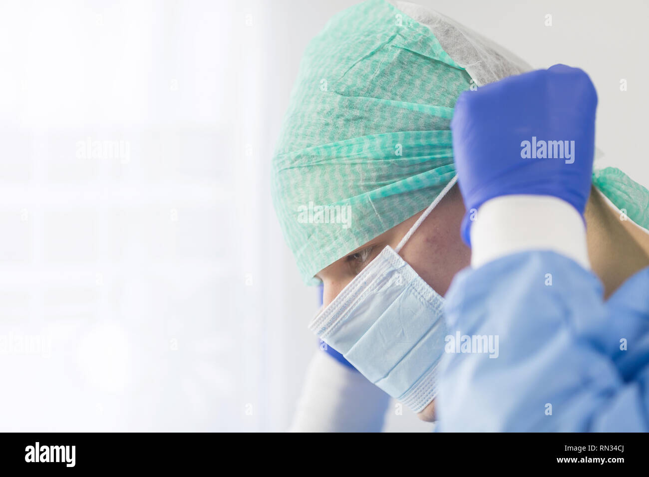 Surgeon Doctor In Sterile Gloves Preparing For Operation In Hospital