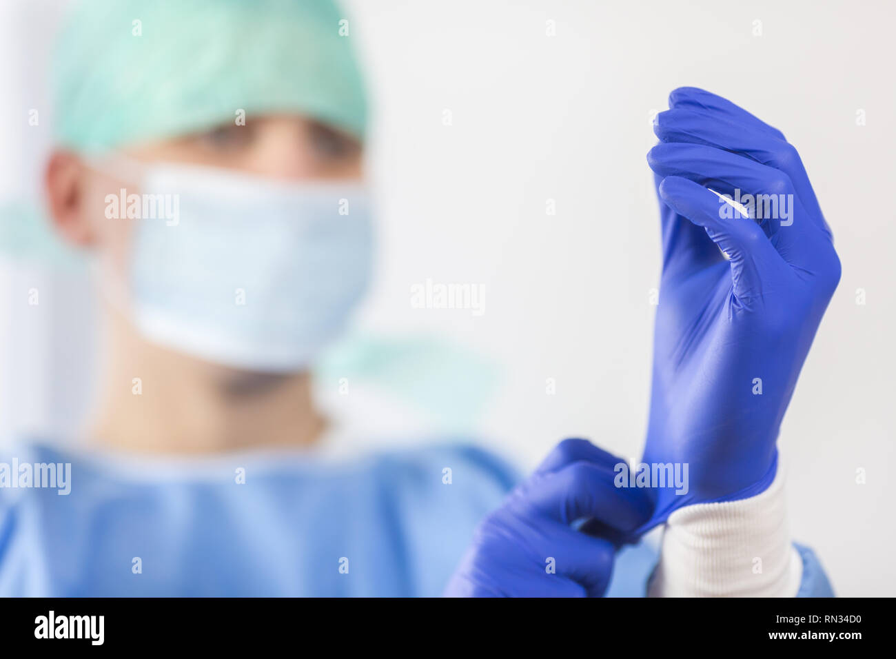 Surgeon Doctor In Sterile Gloves Preparing For Operation In Hospital