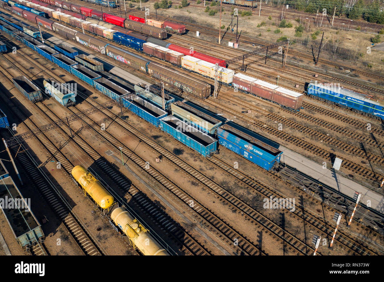 Aerial view of colorful freight trains on the railway station. Wagons ...