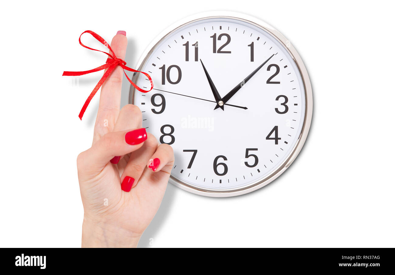 Red bow on finger and clock isolated on white background Stock Photo ...