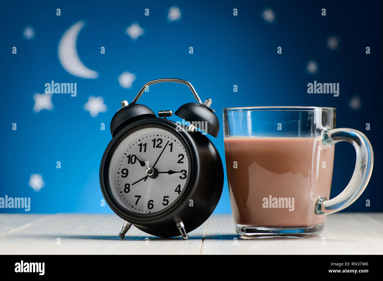 Alarm clock and mug Stock Photo - Alamy