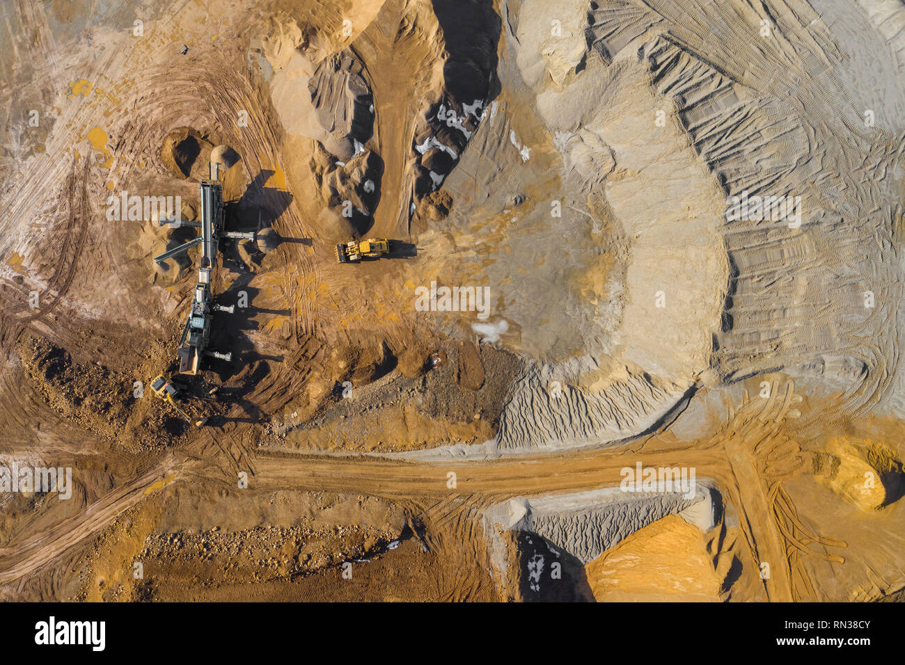 Aerial view of sandpit and factory plant producing sand materials for ...