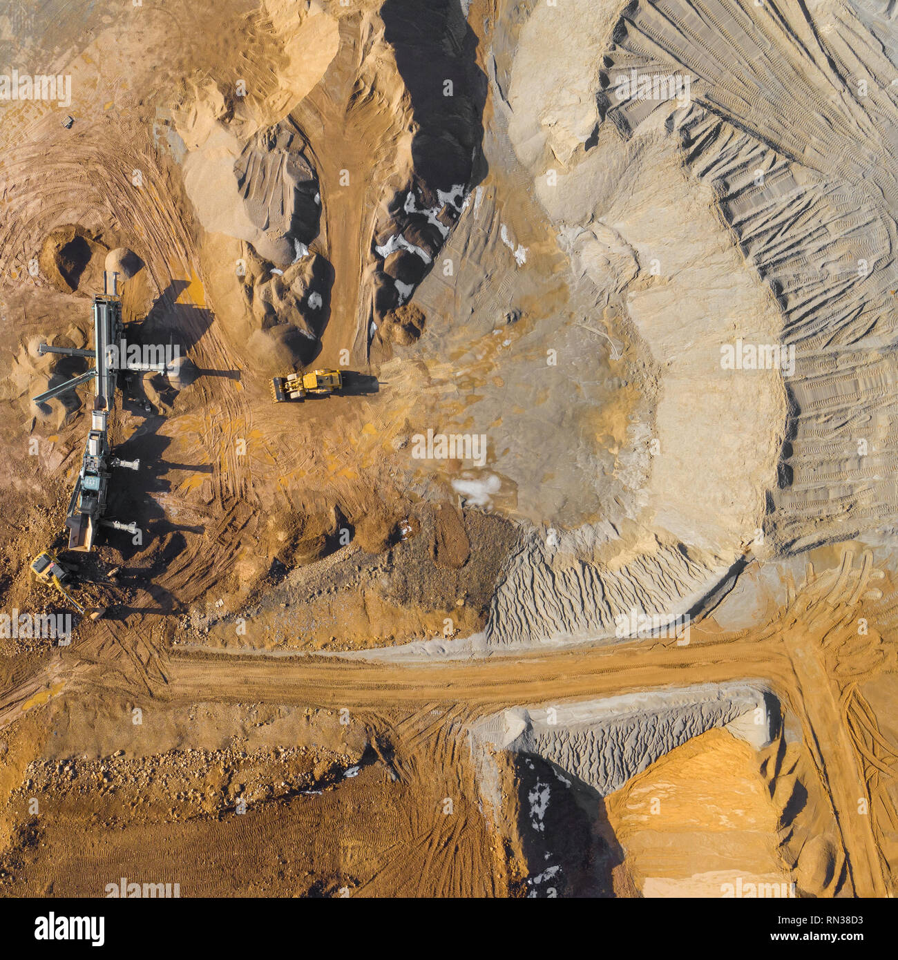 Aerial view of sandpit and factory plant producing sand materials for ...
