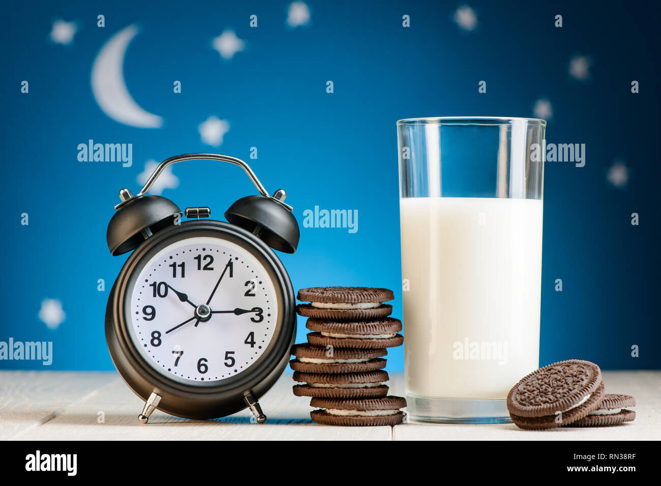 Alarm clock, cookies and milk Stock Photo - Alamy