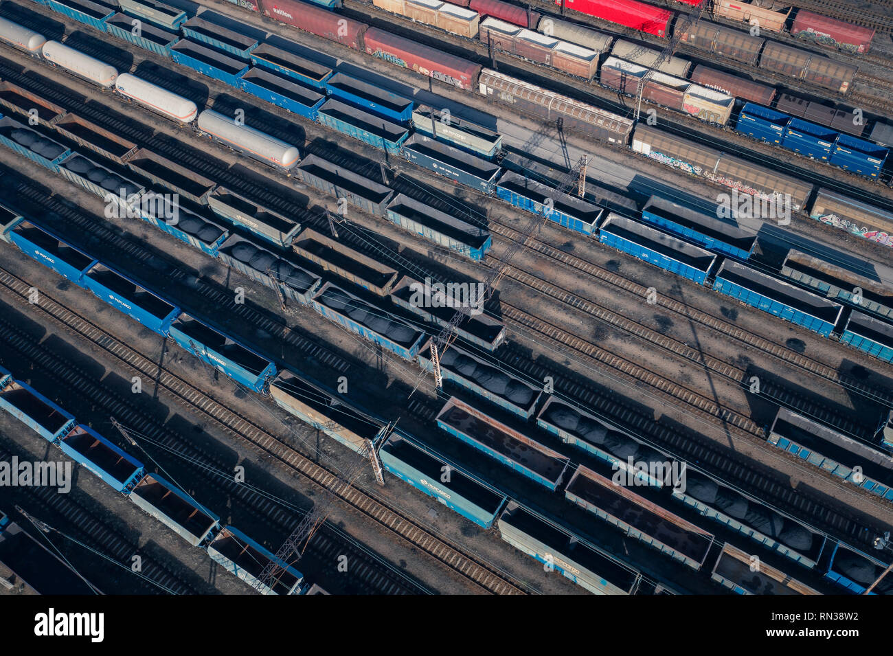 Aerial view of colorful freight trains on the railway station. Wagons ...