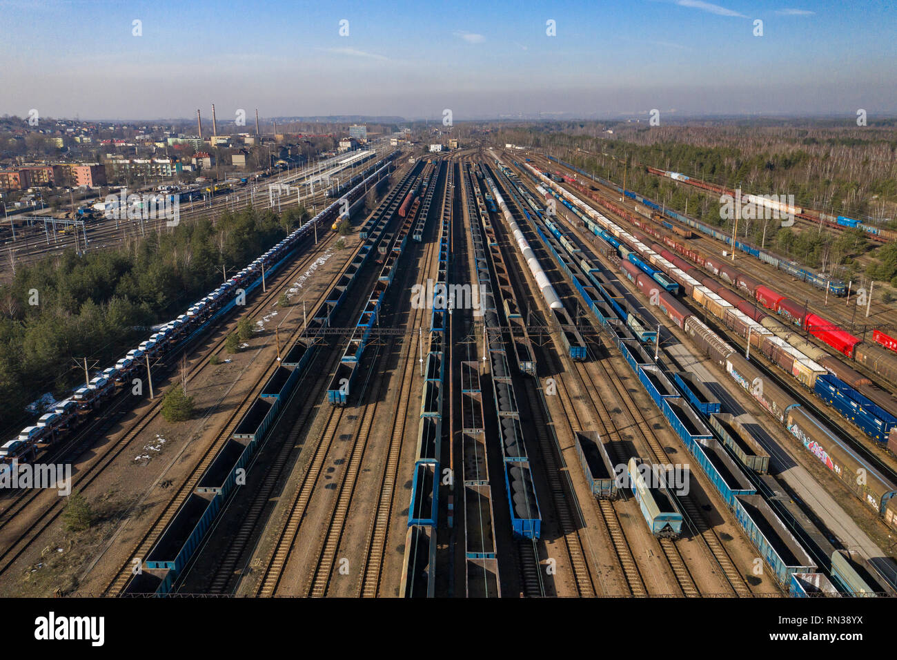 Aerial view of colorful freight trains on the railway station. Wagons ...