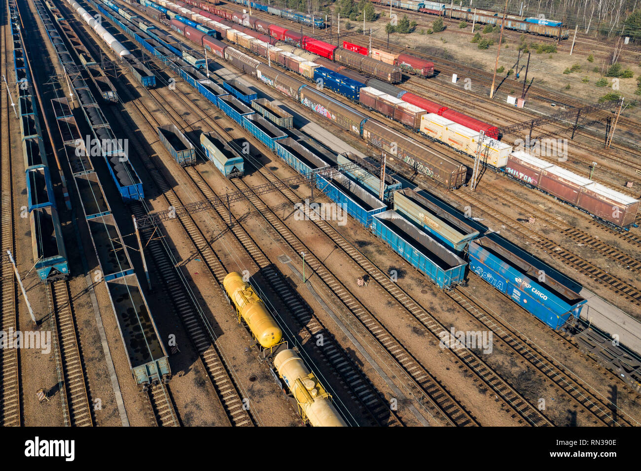Aerial view of colorful freight trains on the railway station. Wagons ...