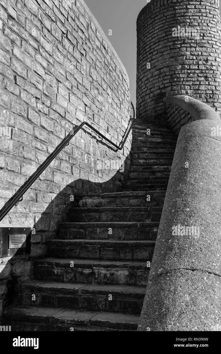 Sweeping steps and curved concrete wall in Lyme Regis, shot in black ...