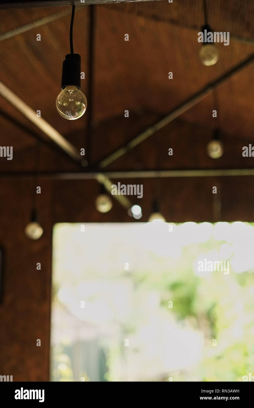 Interior of vintage light bulb hall hang in wooden room. barn decor ...