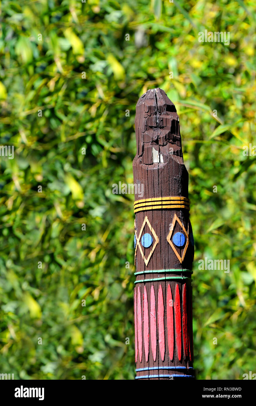 Background image shows a carved fence post in a native design. Diamonds ...