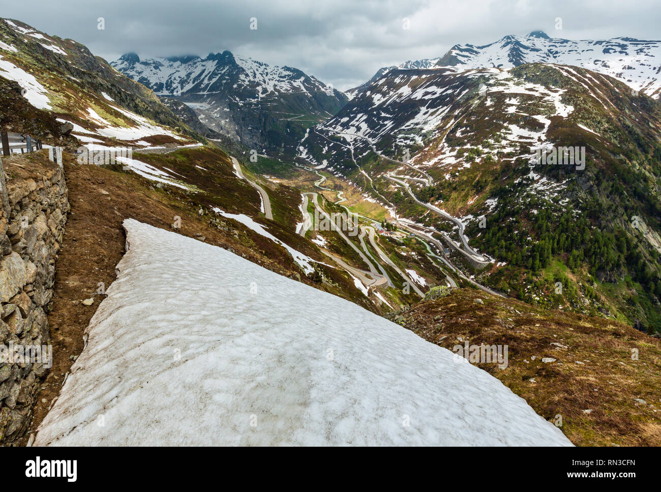 Summer mountain landscape with serpentine alpine roads (Grimsel Pass ...