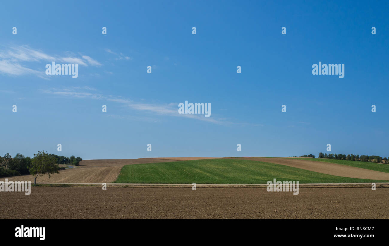 Farmland and clear sky Stock Photo - Alamy