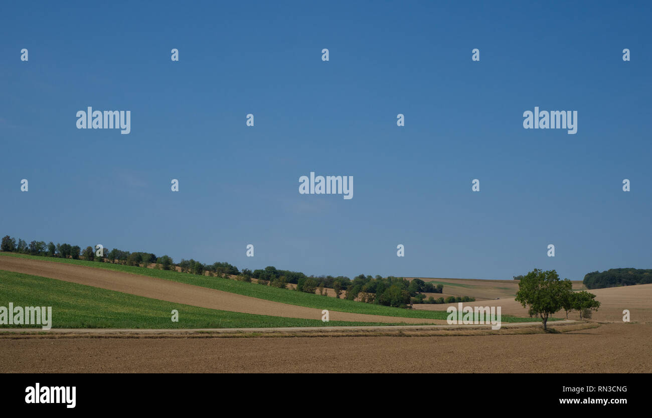 Farmland and clear sky Stock Photo - Alamy