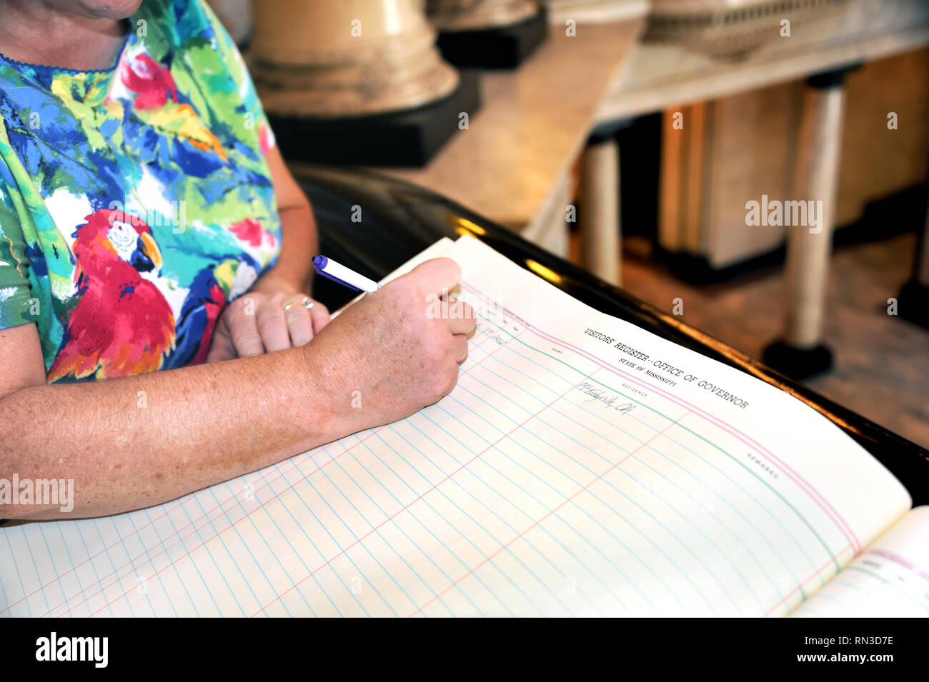 Female visitor to the capital of Jackson, Mississippi, signs the guest ...