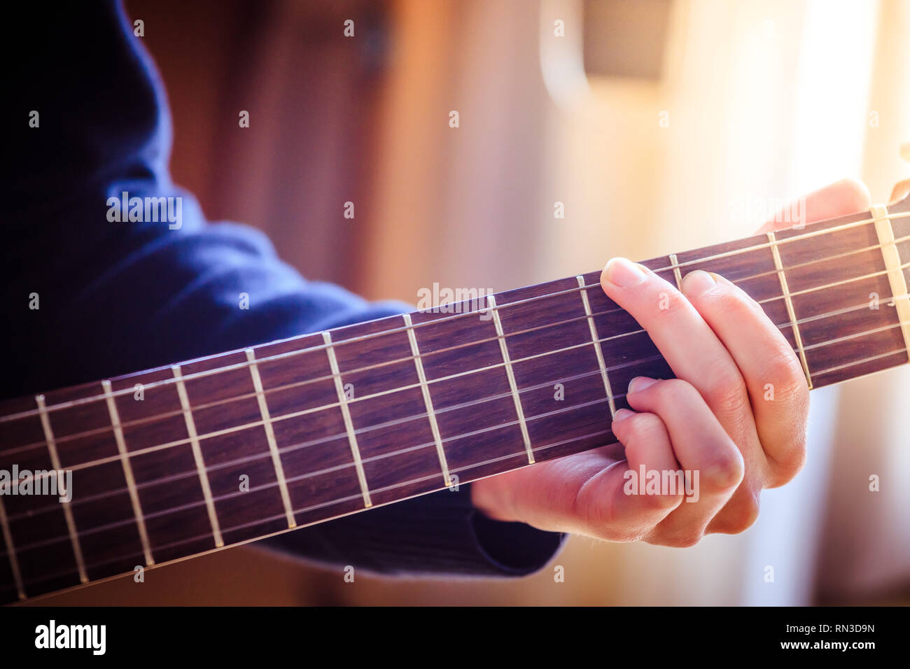 Musician plays a classical guitar, hands, fretboard and fingers Stock ...