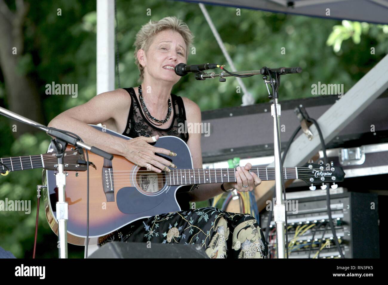 Musician Eliza Gilkyson is shown performing on stage during a "live ...