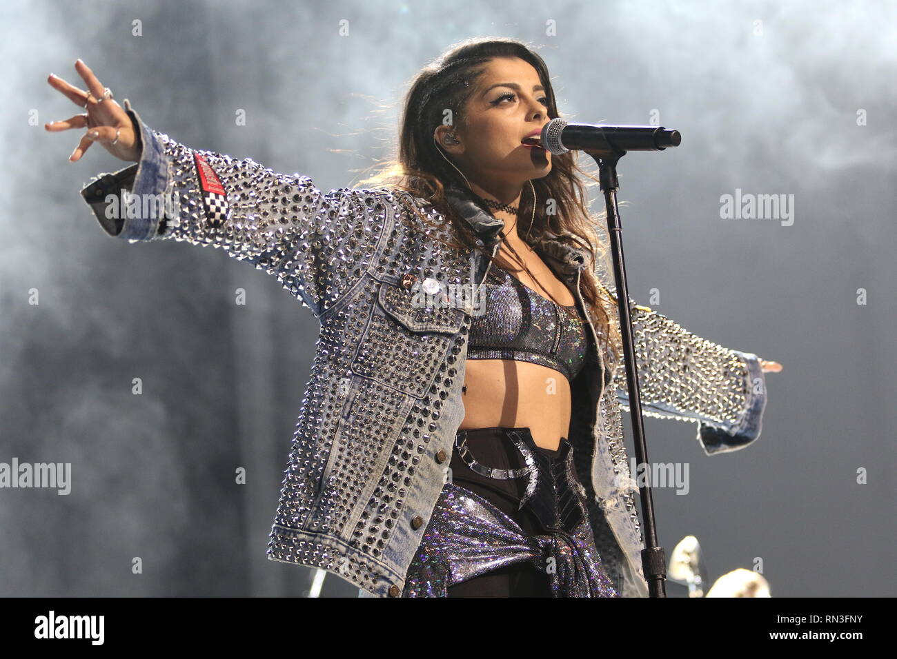 Singer Bebe Rexha is shown performing on stage during a "live" concert ...