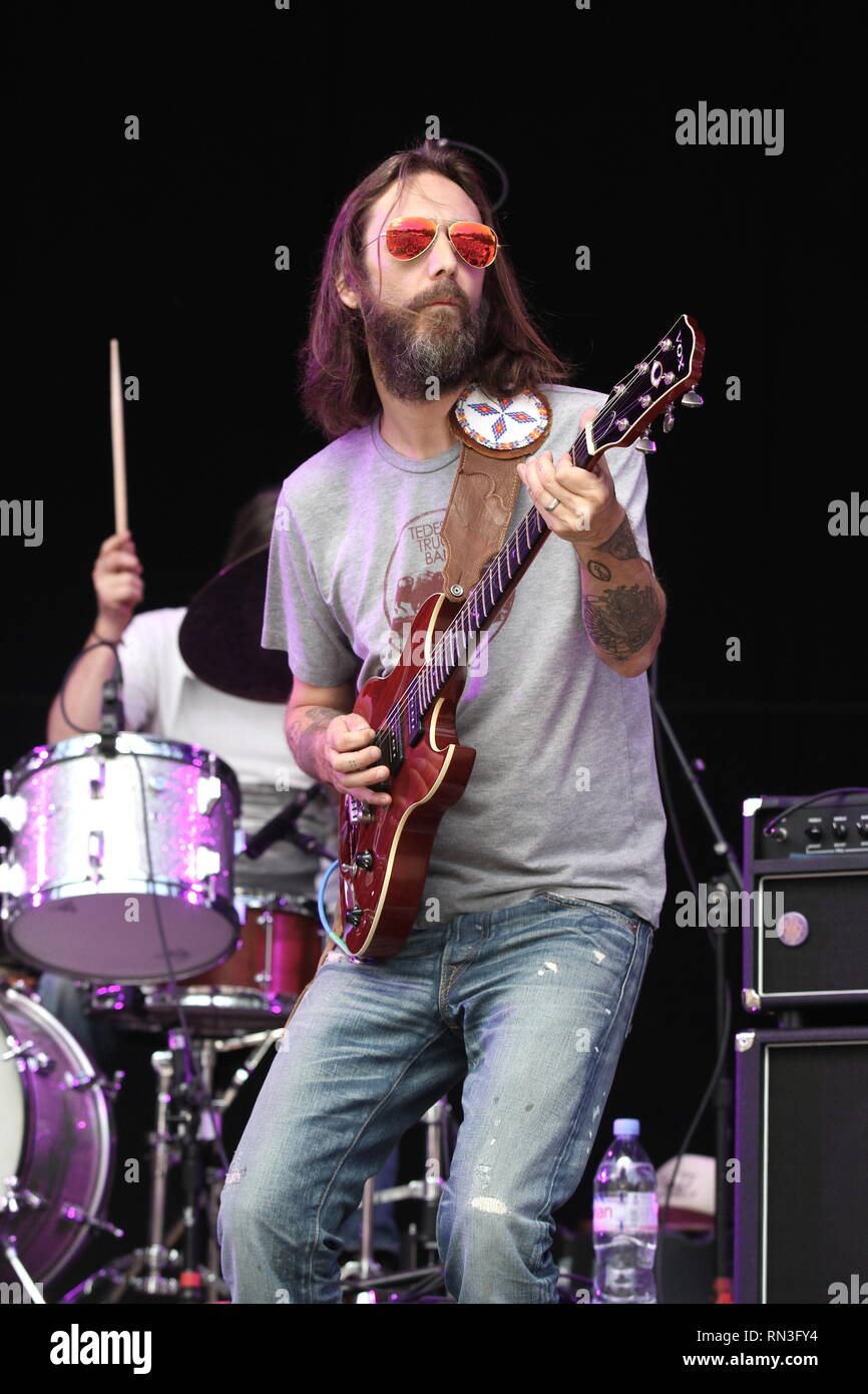 Musician Chris Robinson is shown performing on stage during a "live ...