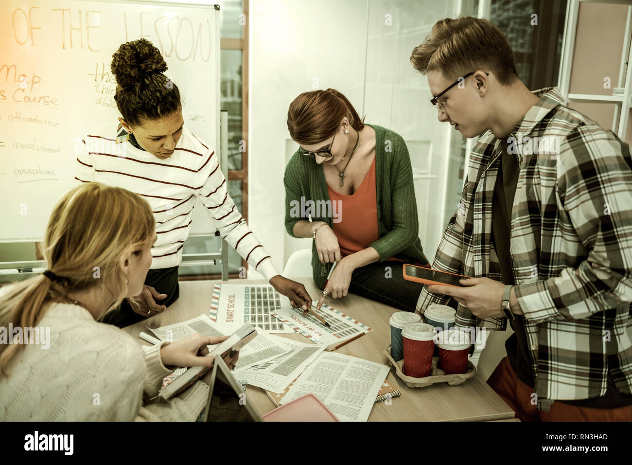 Four students feeling inspired while participating in charity project ...