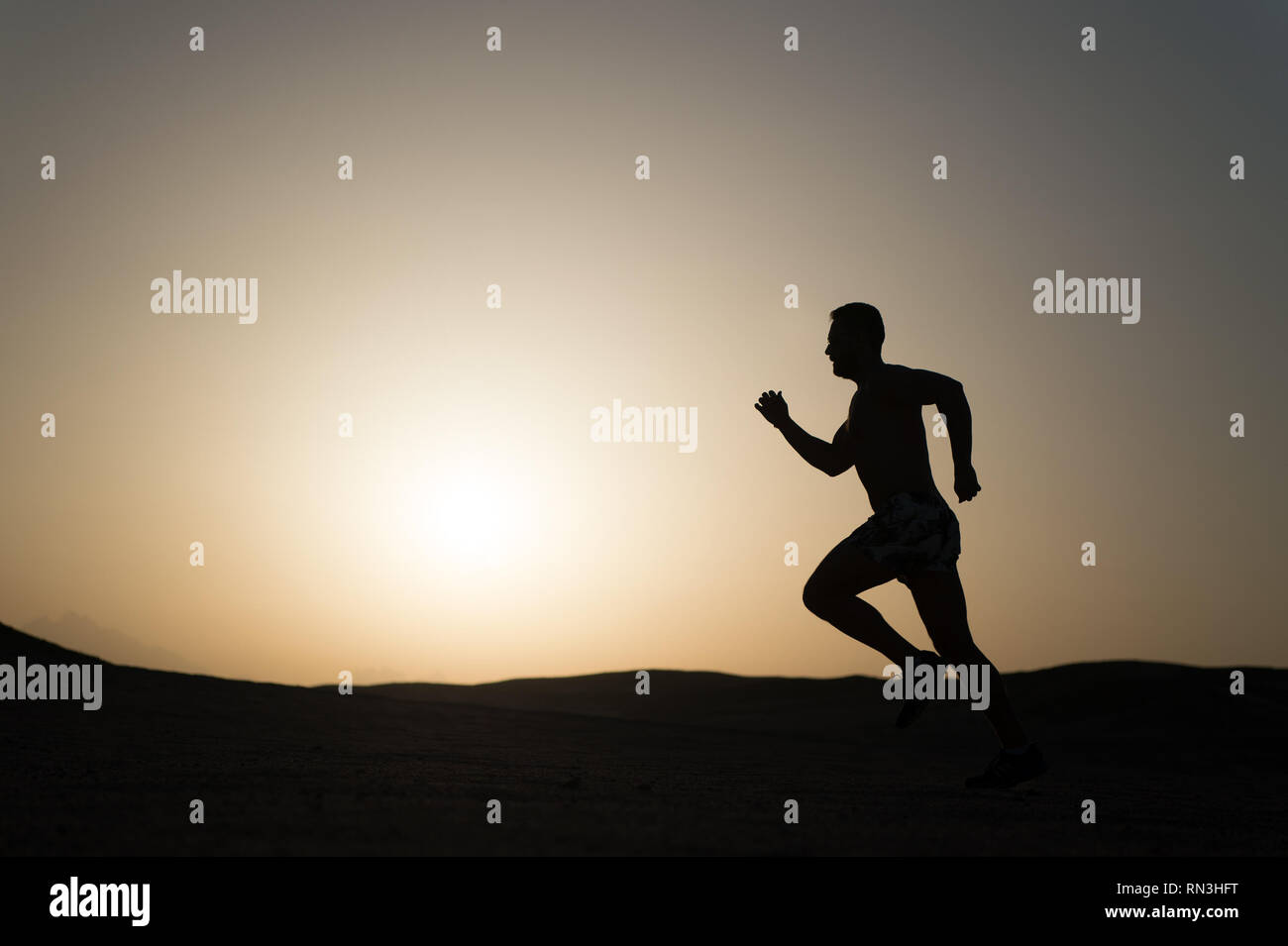 silhouette or man runner, guy running outdoor on clear sky background ...