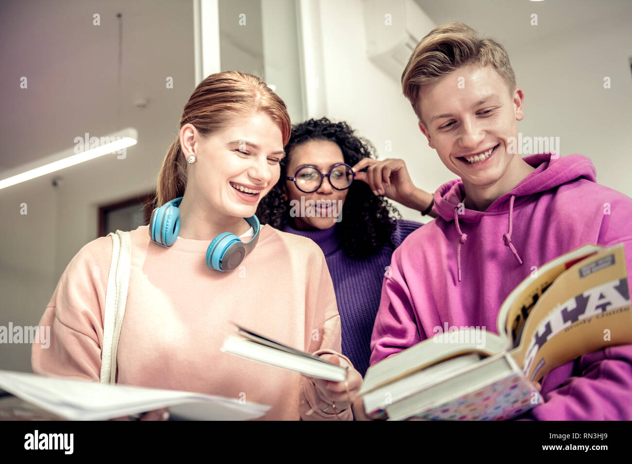 Three students near university hi-res stock photography and images - Alamy