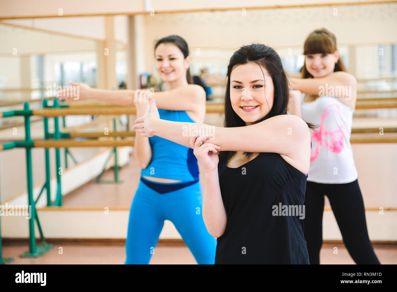 Group of people at the gym in a stretching class Stock Photo - Alamy