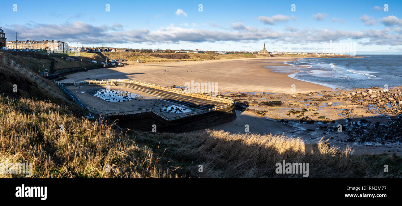 Tynemouth, England, UK - February 4, 2019: People walk their dogs on ...