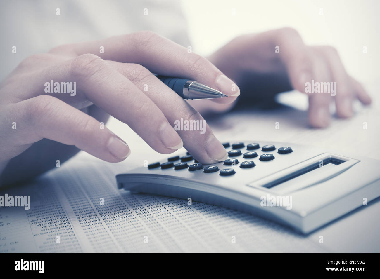 Woman with calculator hi-res stock photography and images - Alamy