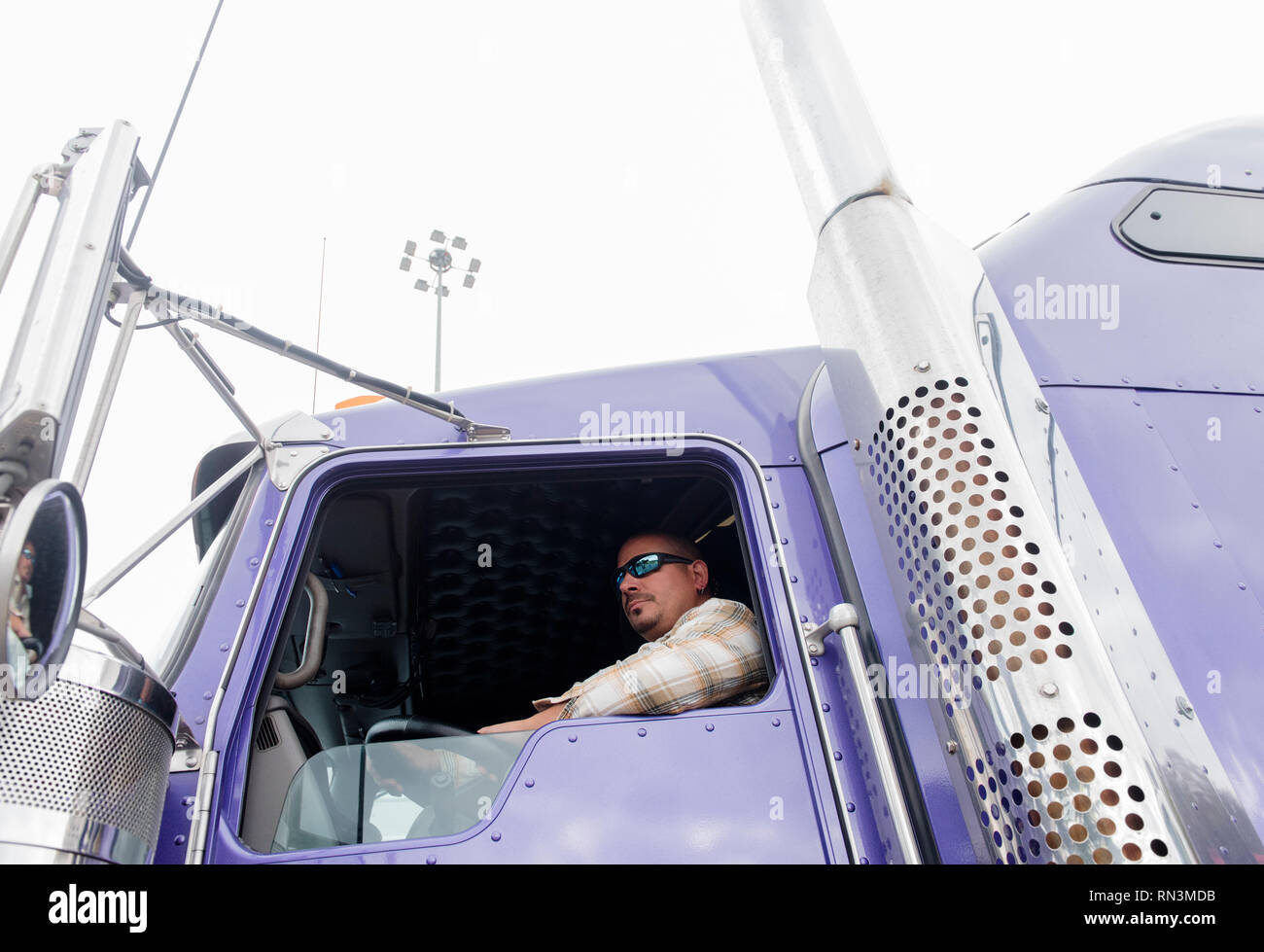 Man driving semi-truck Stock Photo - Alamy