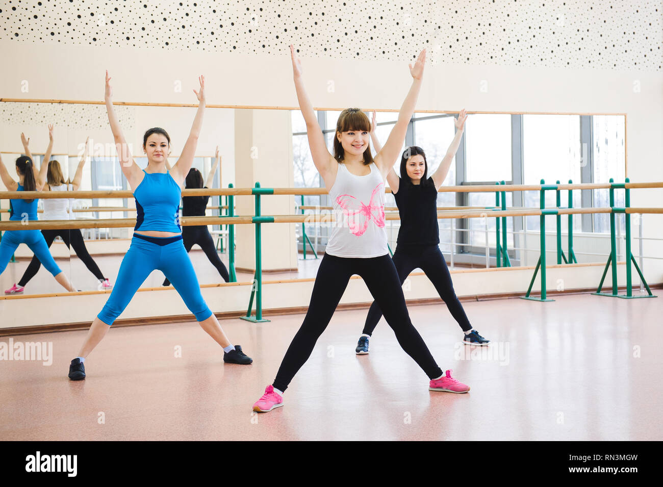 Group of people at the gym in a stretching class Stock Photo - Alamy