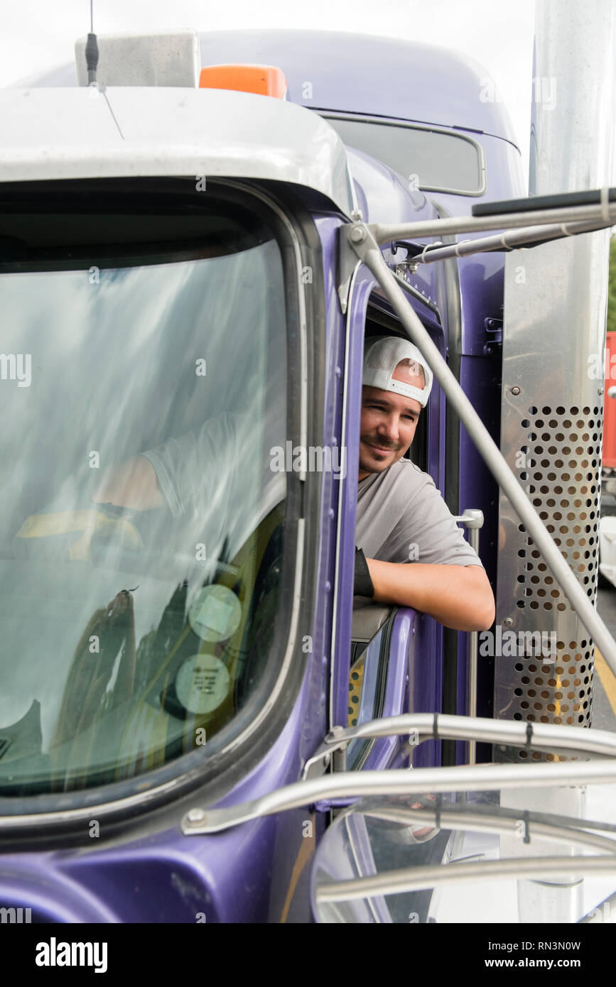 Man driving semi-truck Stock Photo - Alamy