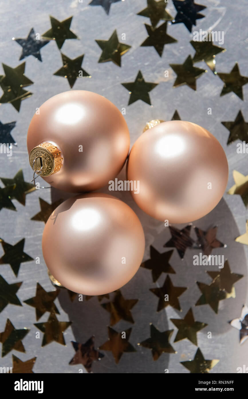 Christmas baubles and star shape confetti Stock Photo - Alamy