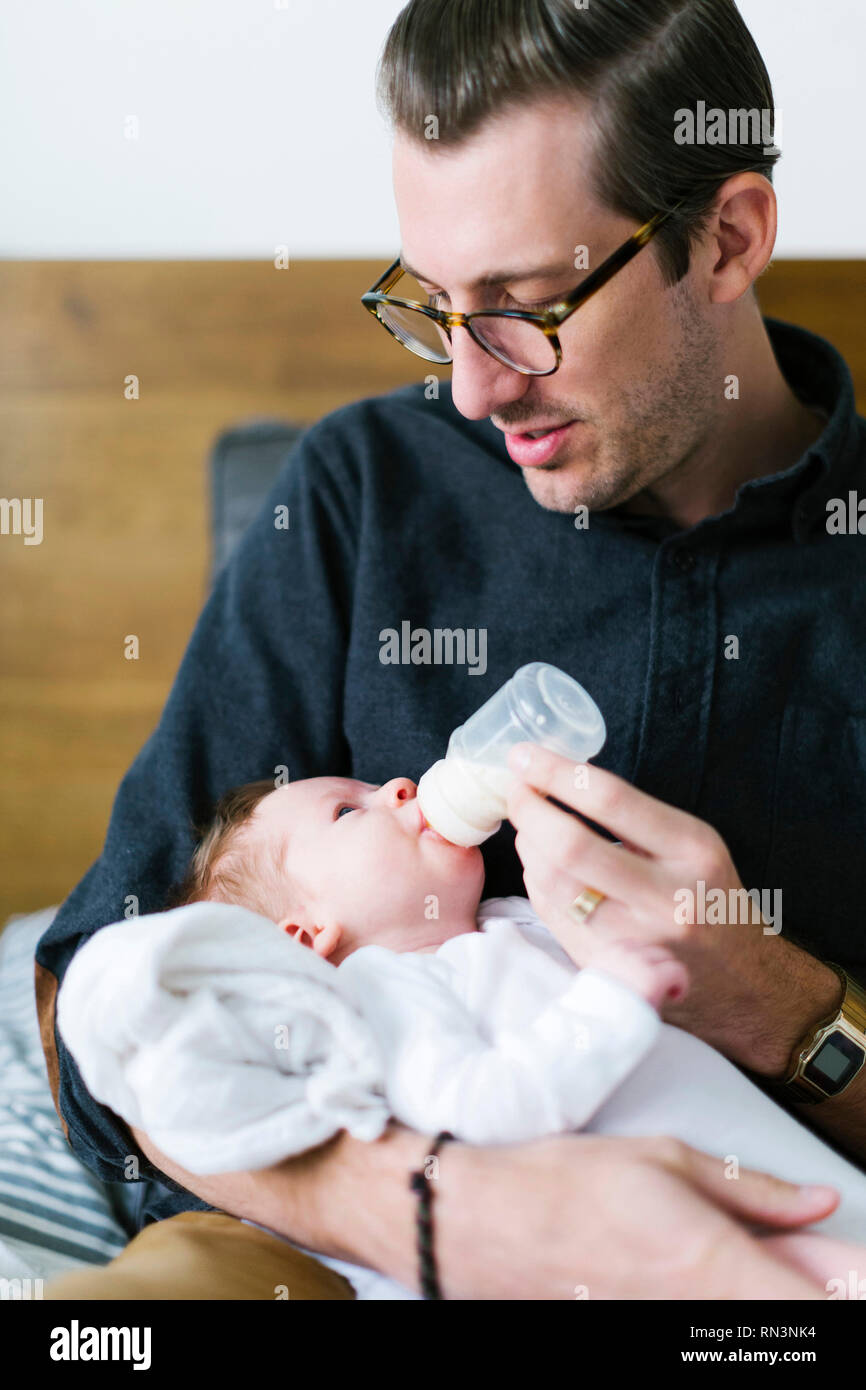 Man two boys feeding hi-res stock photography and images - Alamy