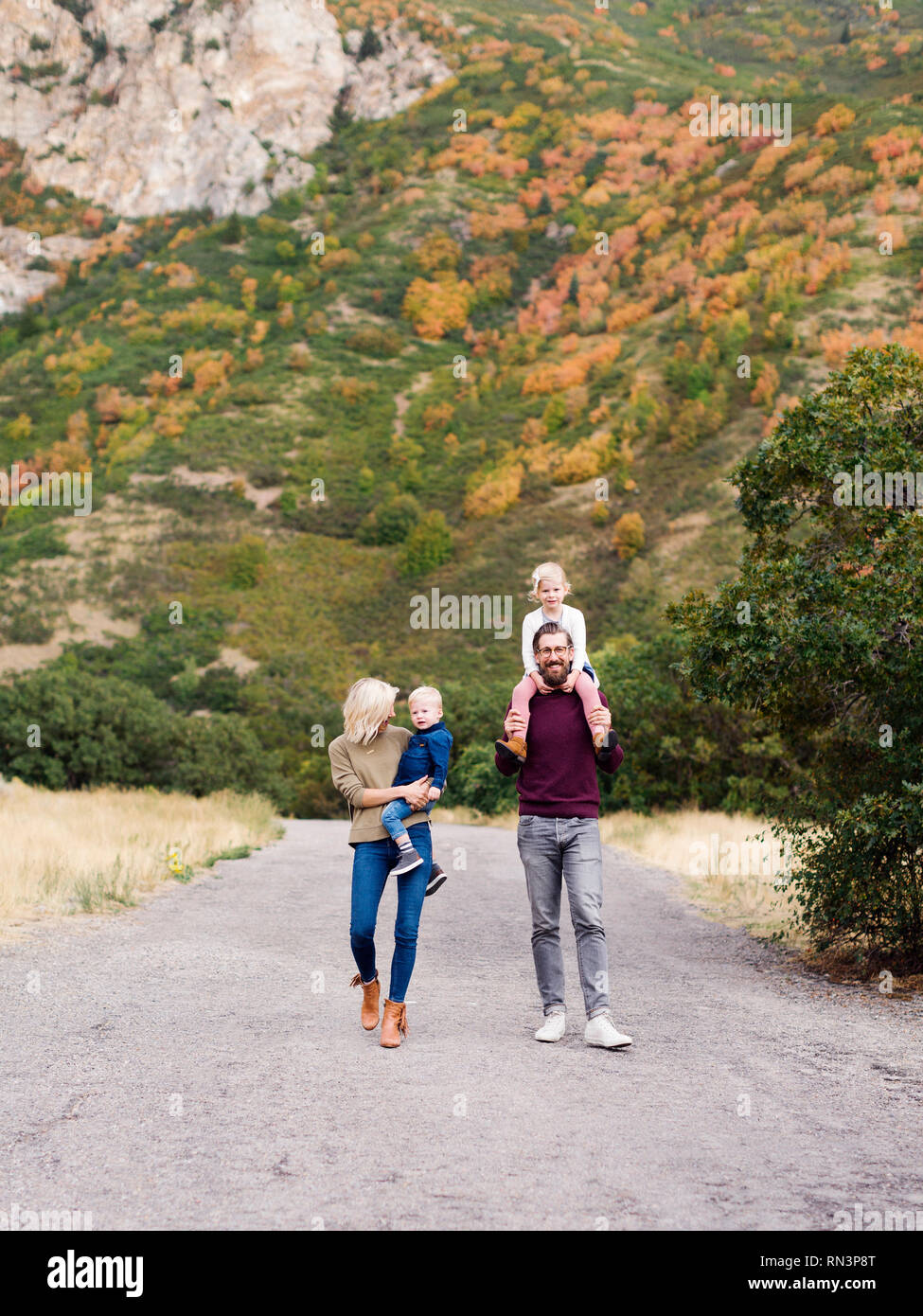 Family walking on rural road together Stock Photo - Alamy