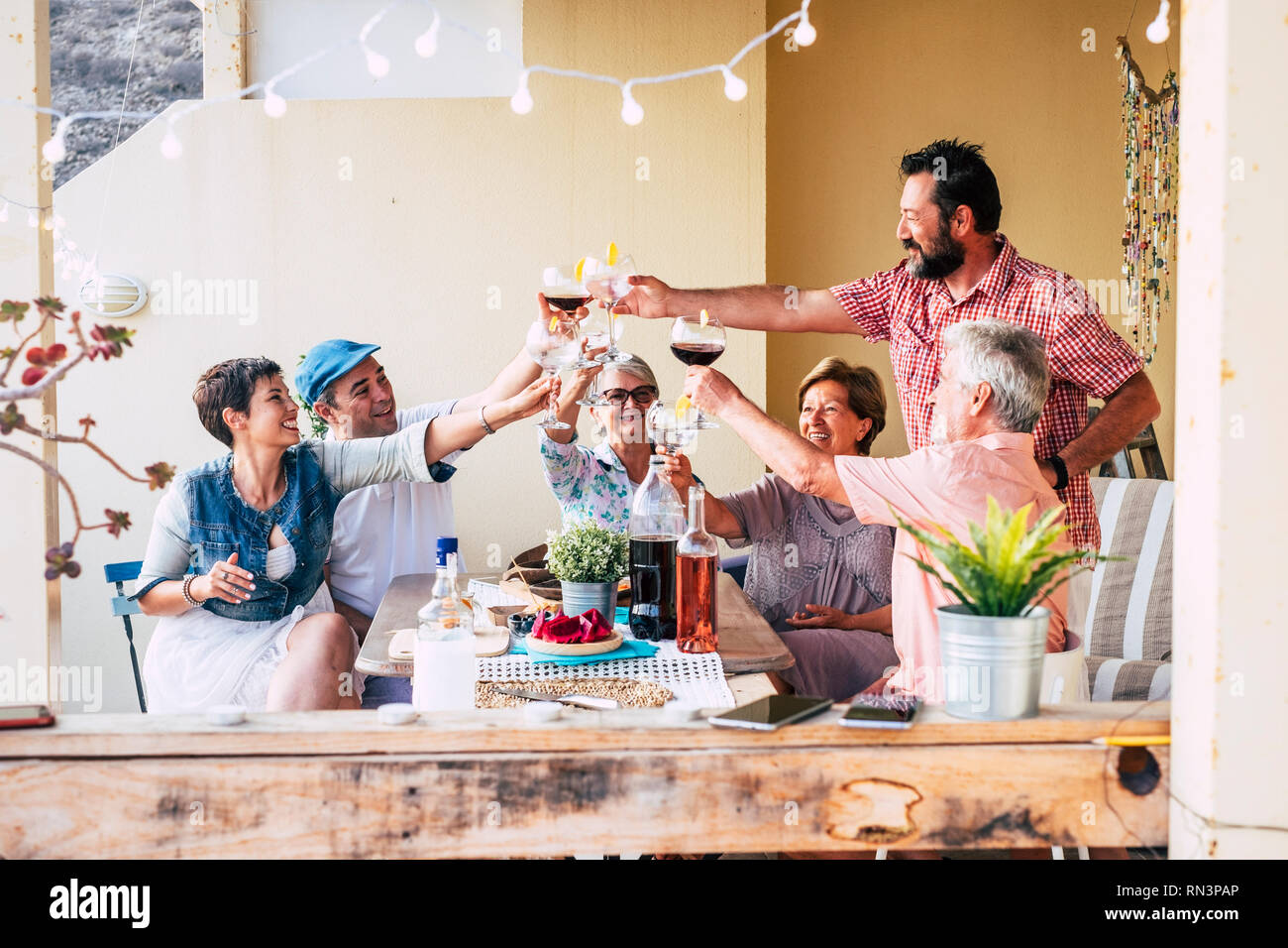 Group of mixed ages and generations friends family have fun together ...