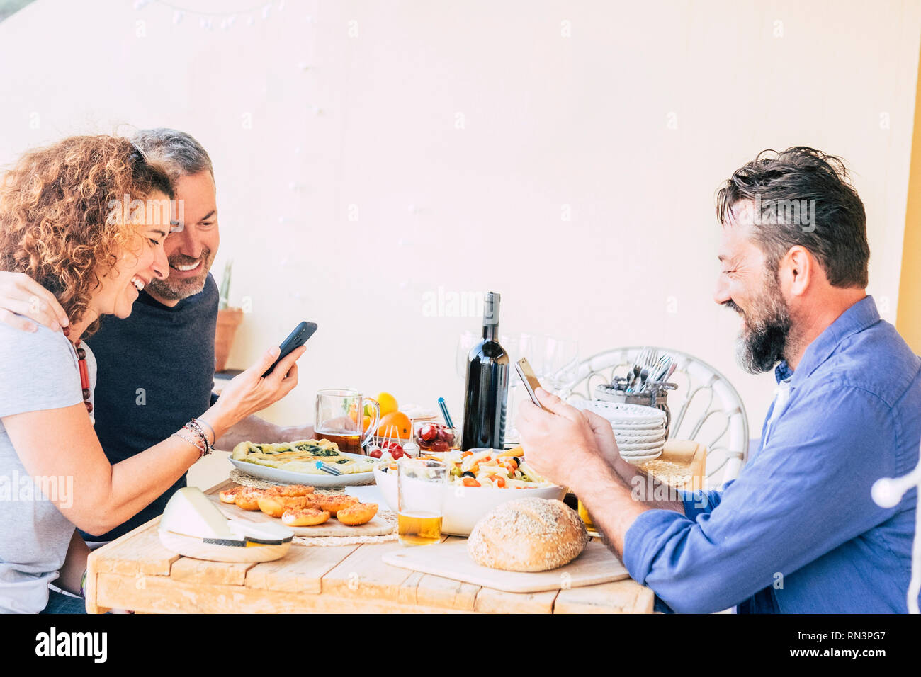 Three men enjoying at the restaurant hi-res stock photography and ...