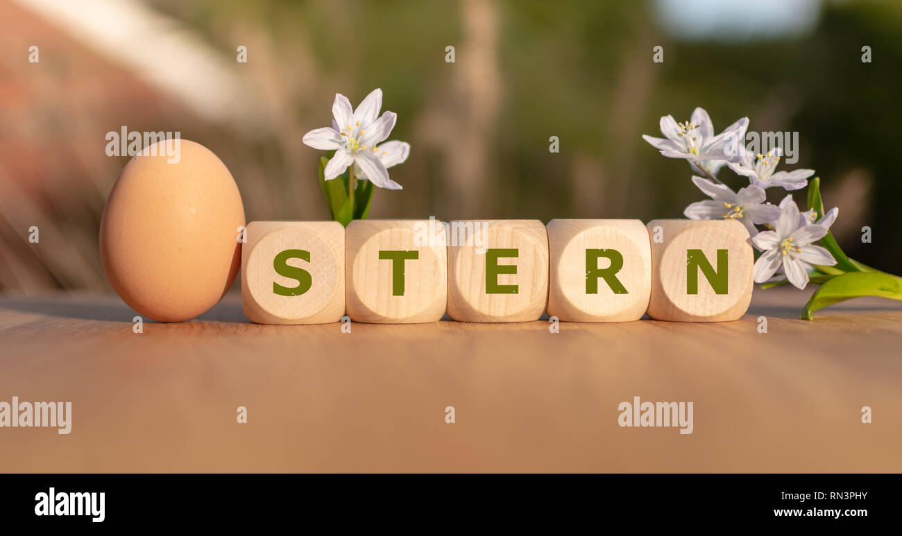 One Egg and dice form the German word "OSTERN" ("EASTER" in English) on ...